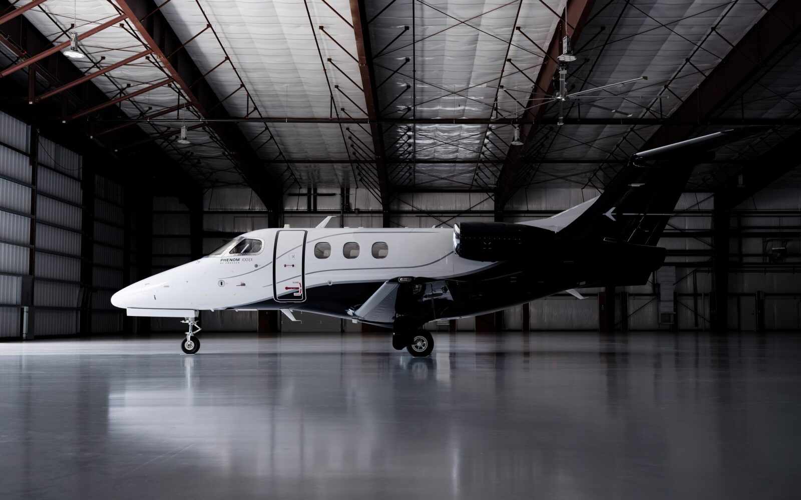 Embraer unveils new upgraded Phenom 100EX private jet: video