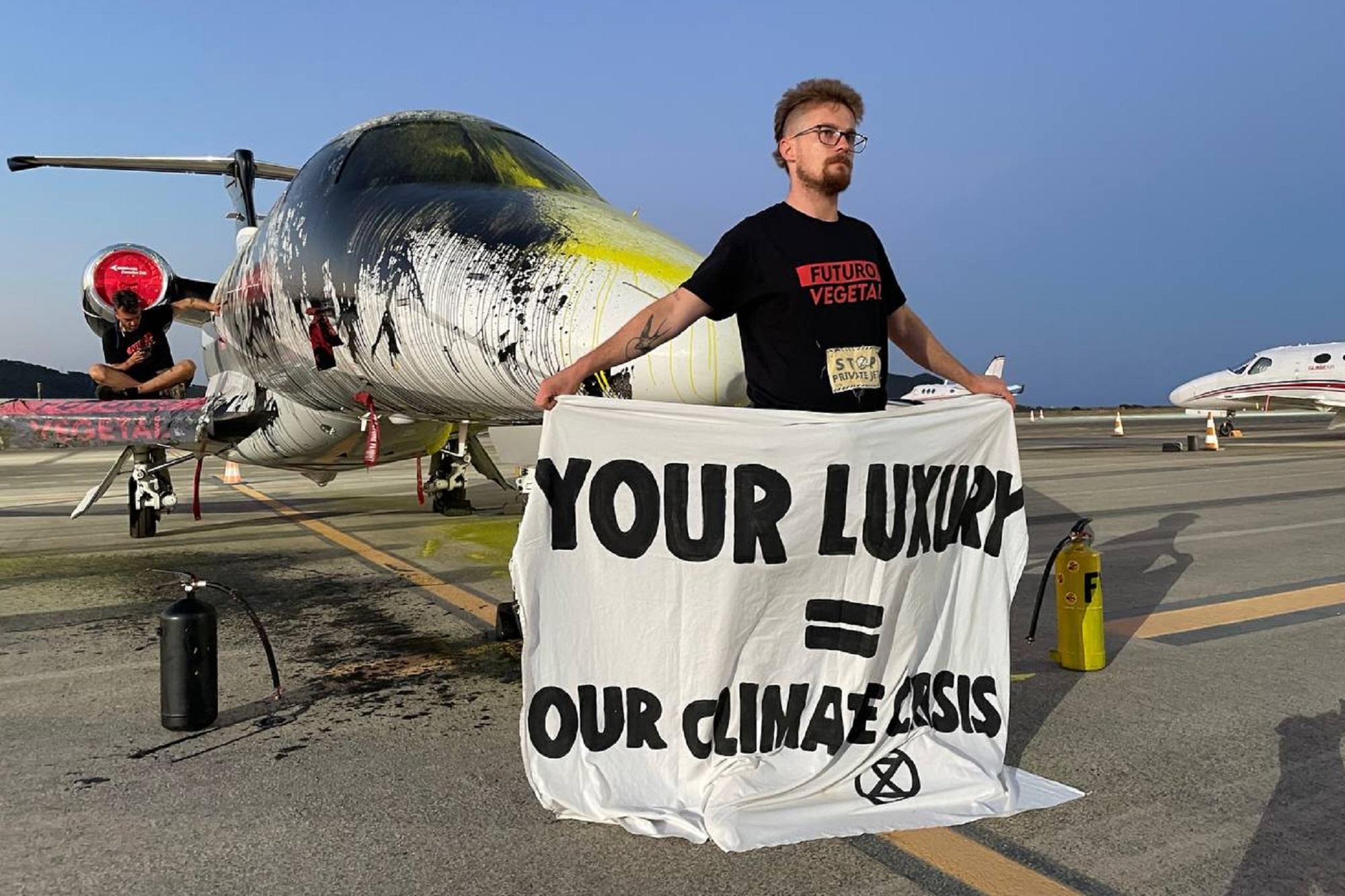 Protestors deface private jet in a cocktail of paint: video