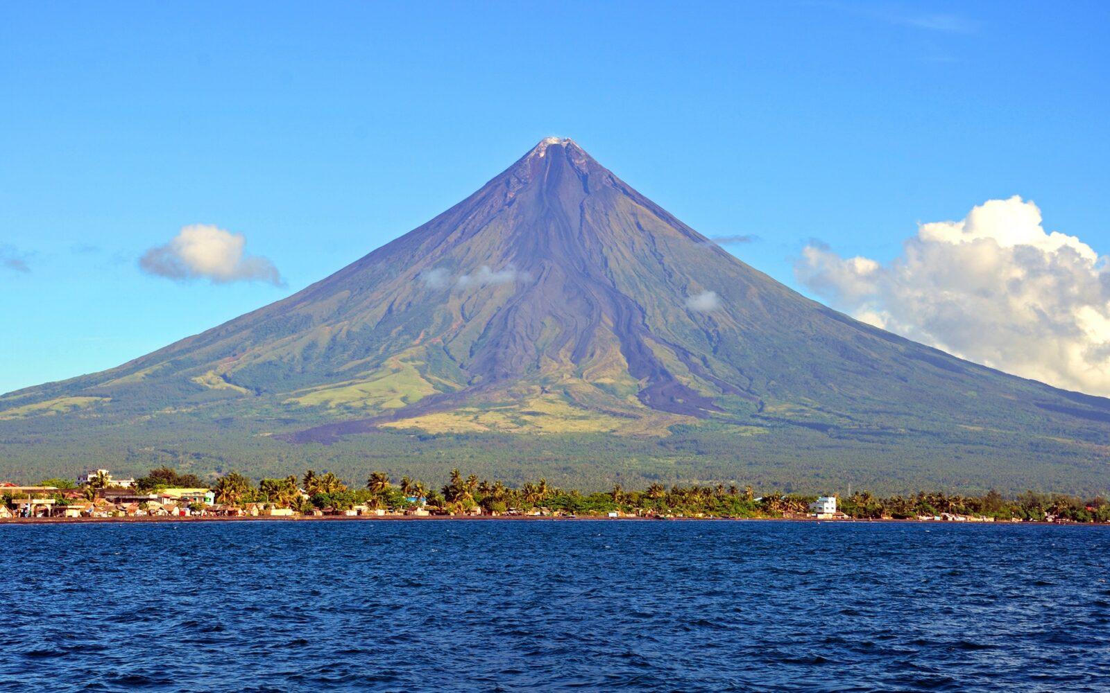 Rescuers climb Philippine volcano after crash site spotted.