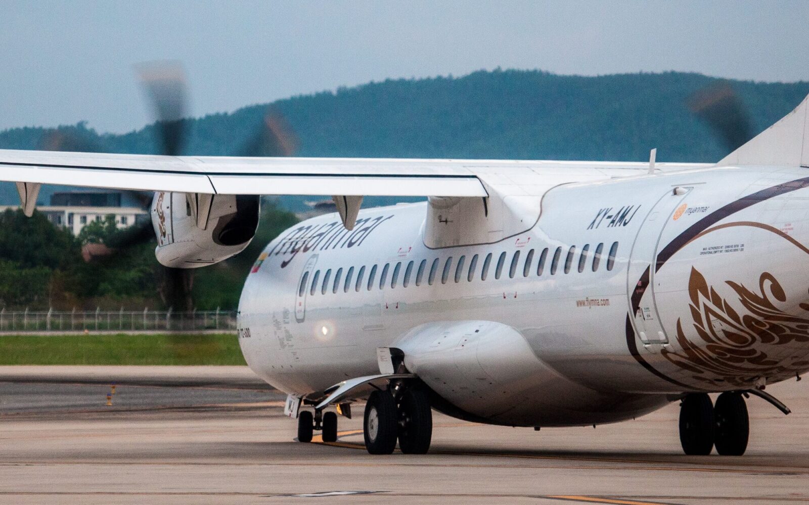 Myanmar National Airlines plane attacked by gunfire; one passenger ...