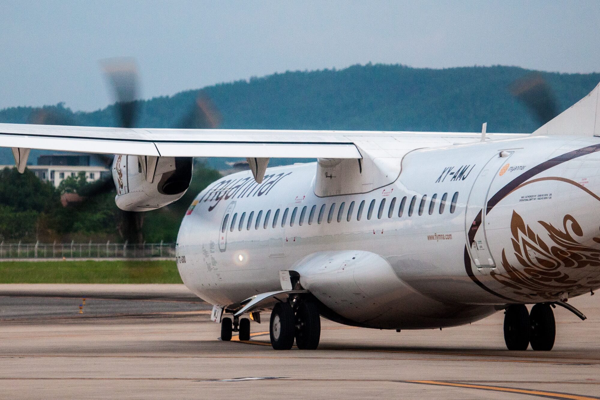 Myanmar National Airlines plane attacked by gunfire; one passenger ...